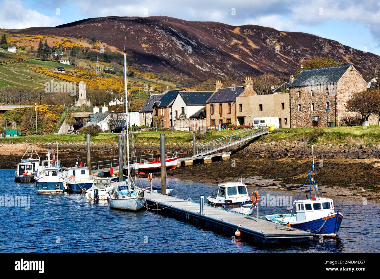 Helmsdale harbour for the pier looking towards the war memorial Stock ...