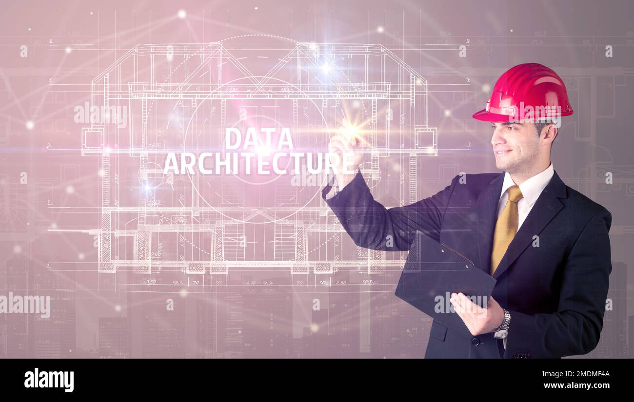 Handsome architect drawing with helmet Stock Photo - Alamy