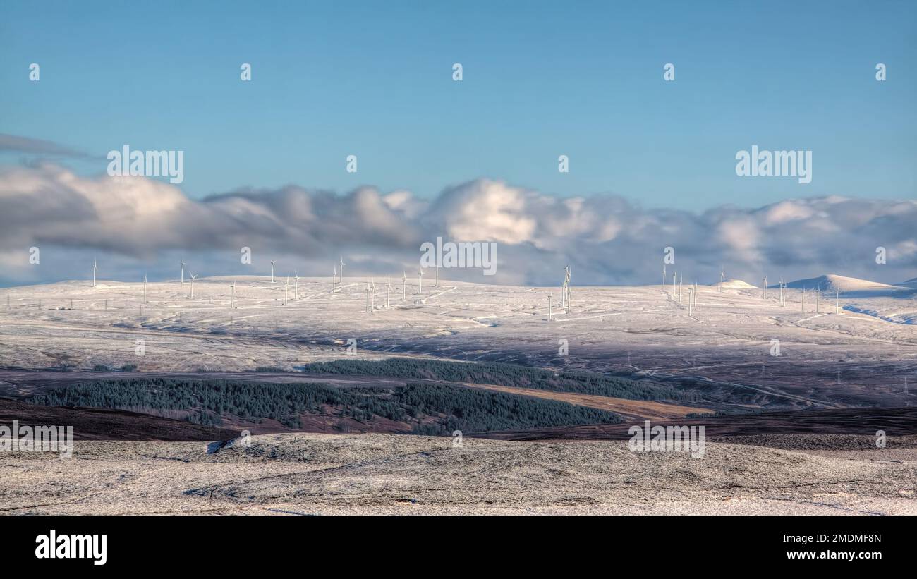 Gordonbush windfarm from Ben Horn in winter with snow on the hills ...