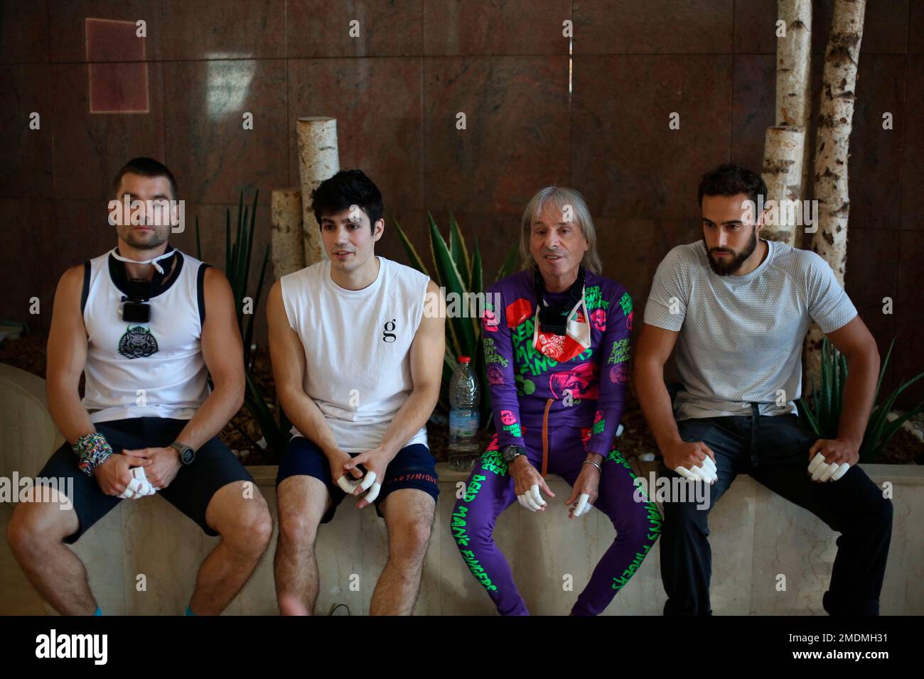 Climbers Marcin Banot, from Poland, left, France's Alexis Landot, Alain ...