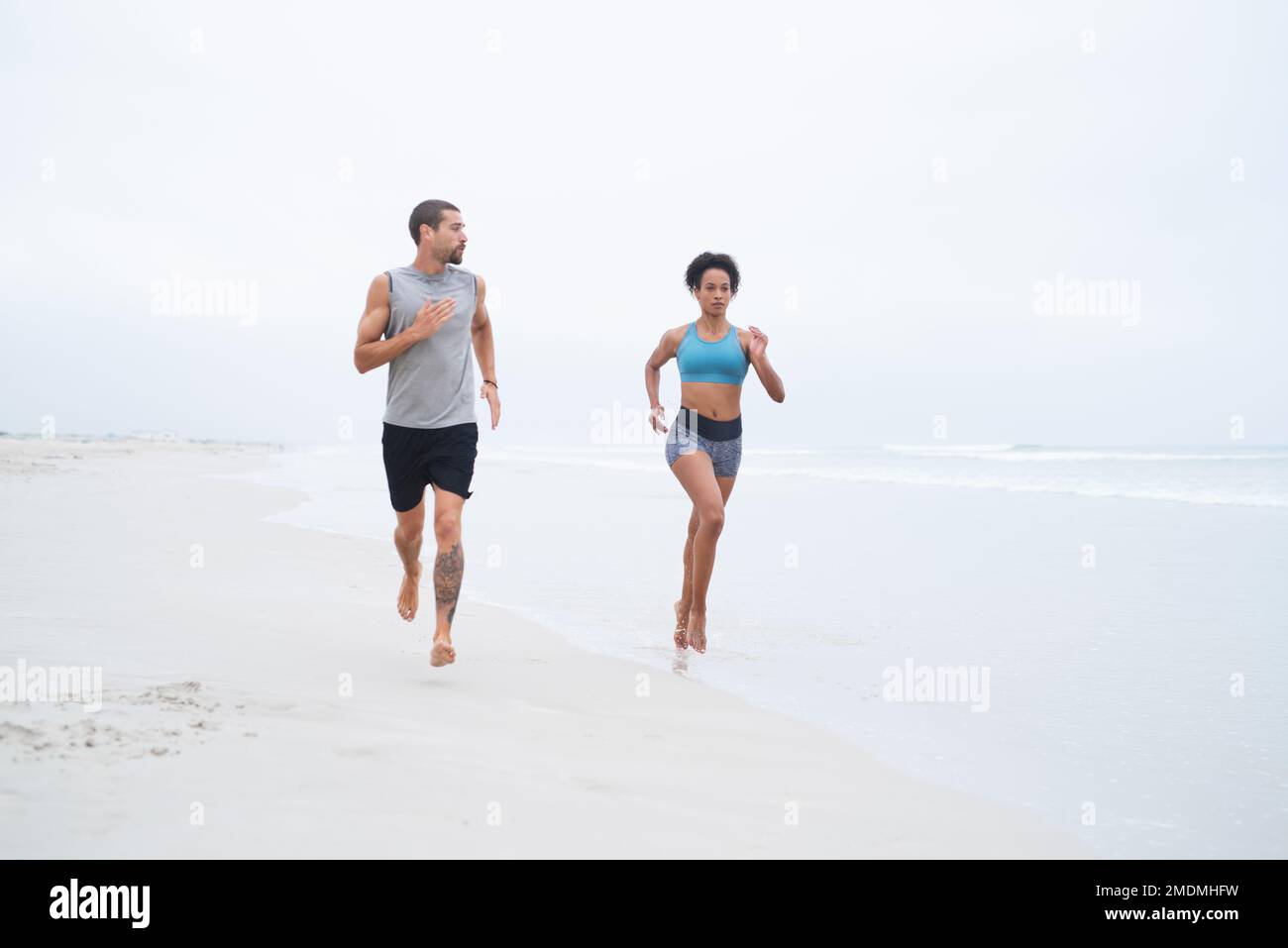 More fresh air means less fatigue. a young couple running along the ...