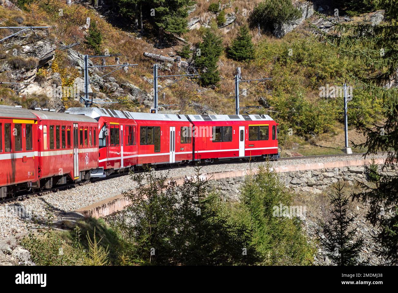 bernina express mountain railway train approaching tunnel near cavaglia ...