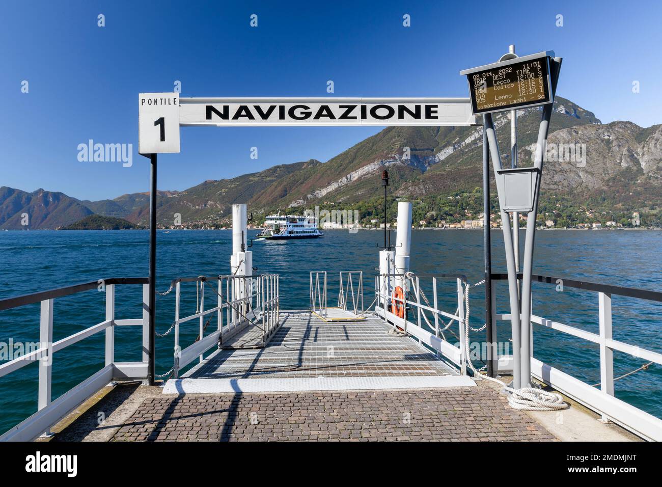 ferry boat terminal at bellagio lake como with ferry vessel in ...