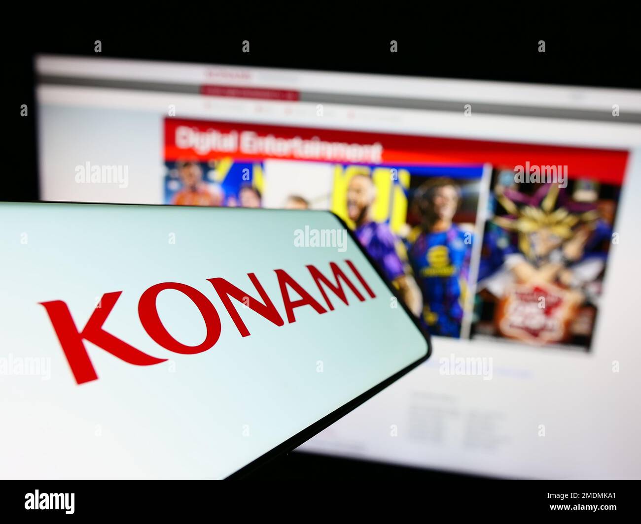 Mobile phone with logo of Japanese company Konami Group Corporation on ...