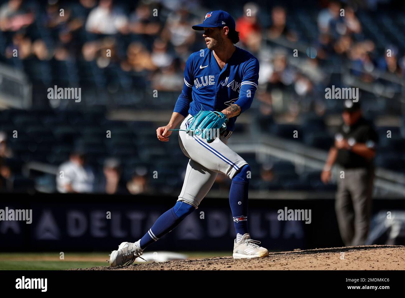 Toronto Blue Jays pitcher Adam Cimber follows through on a pitch ...