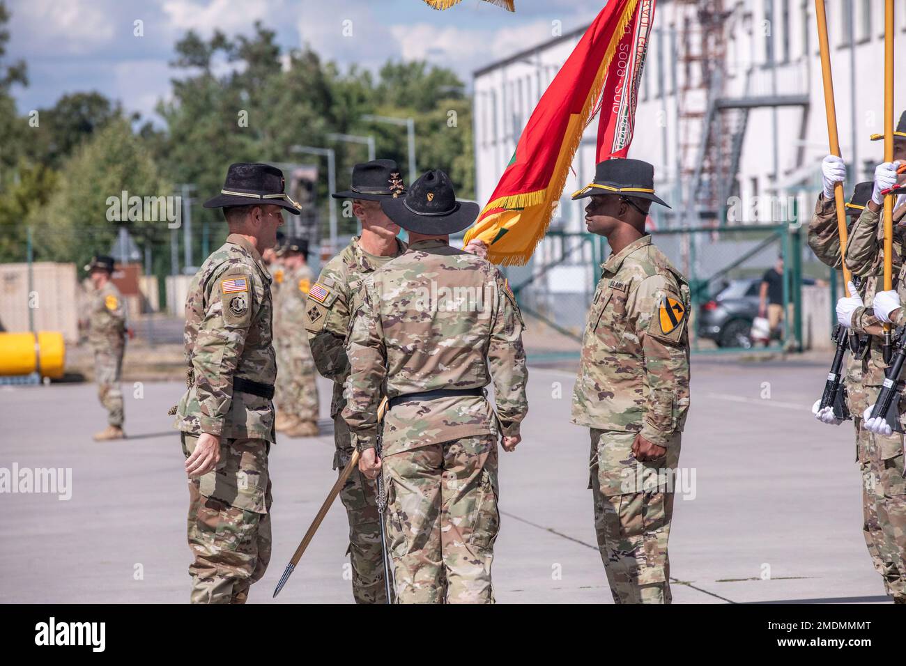 Col. Timothy Jaeger returns the brigade colors to Command Sgt. Maj ...