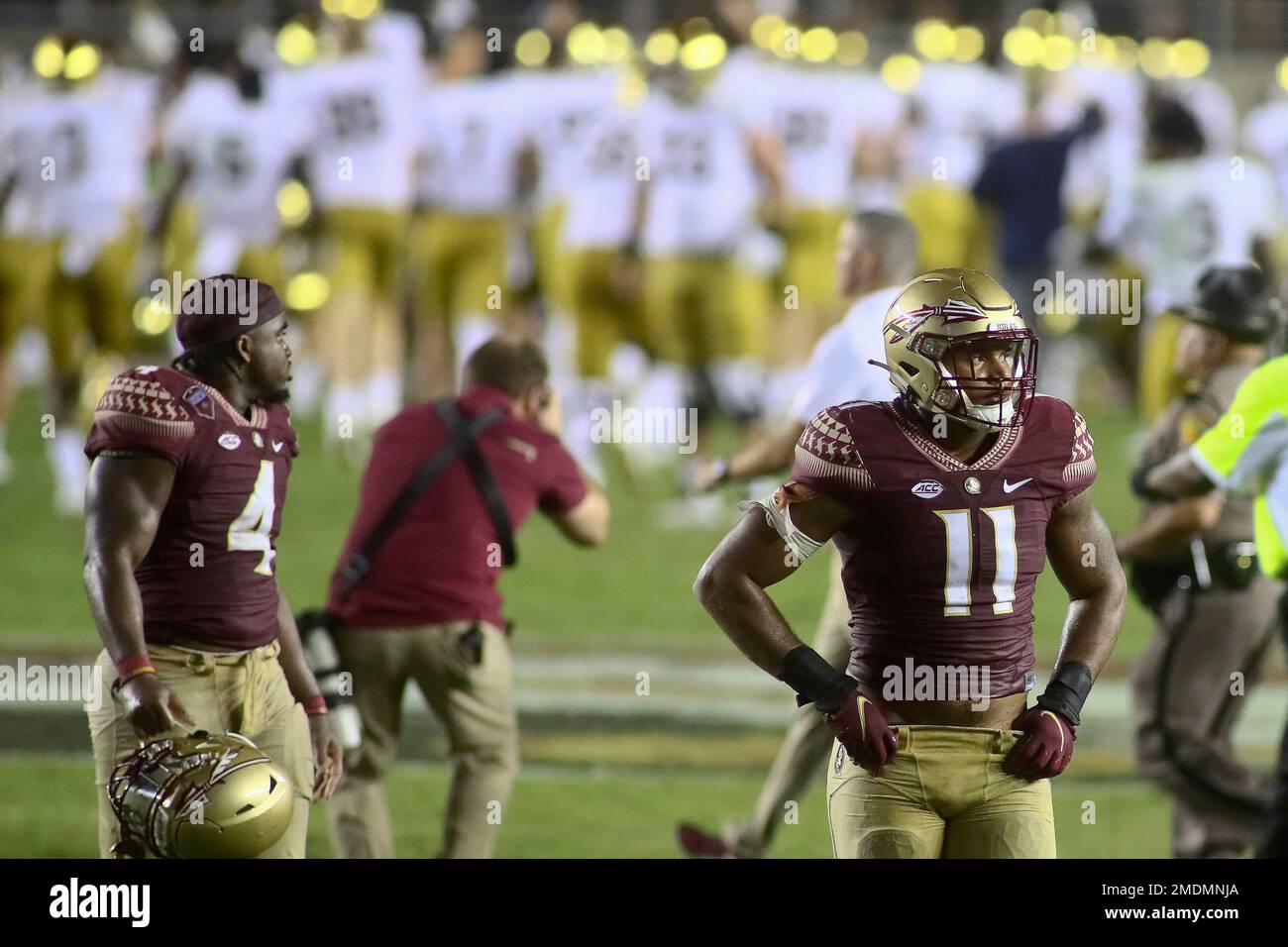 Florida State defensive ends Keir Thomas (4) and Jermaine Johnson II ...