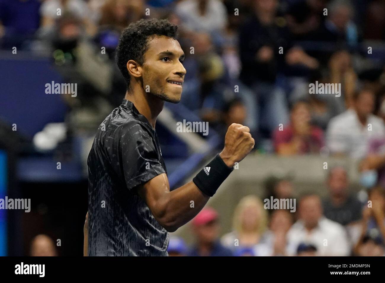 Felix Auger-Aliassime, of Canada, reacts after winning the third set against Frances Tiafoe, of ...