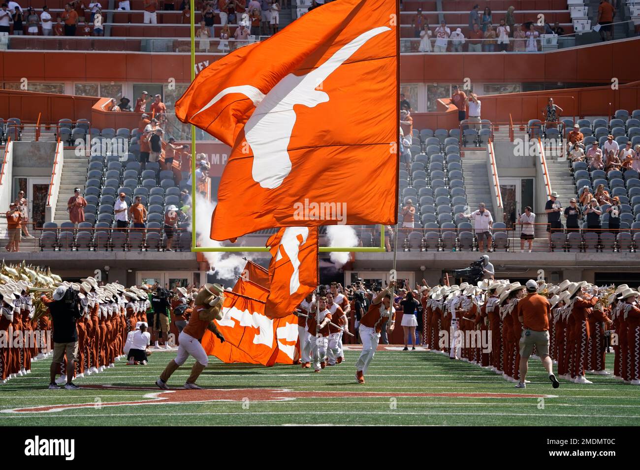 Texas players take the field before an NCAA college football game ...