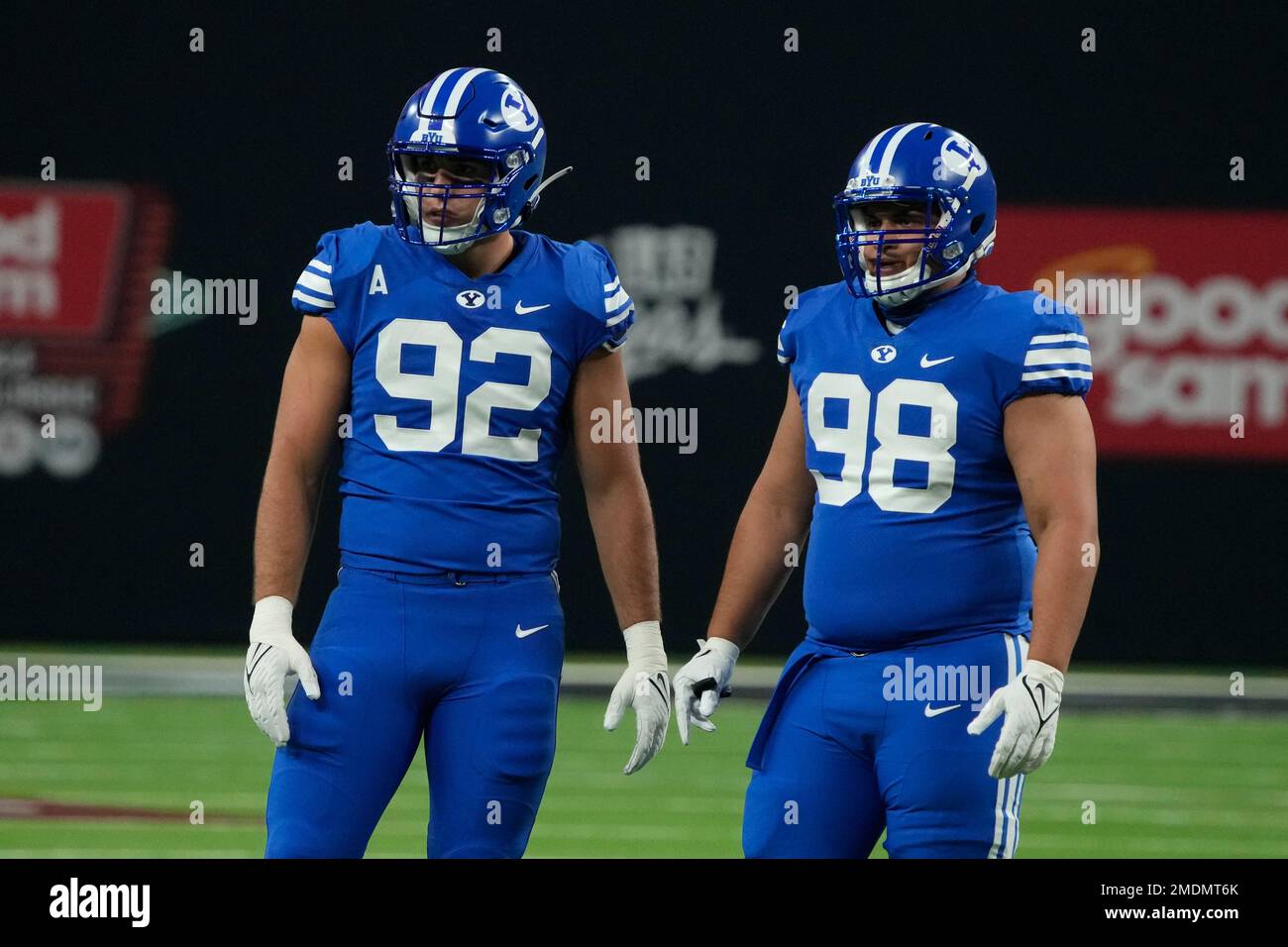 Brigham Young defensive lineman Tyler Batty (92) and Gabe Summers (98 ...