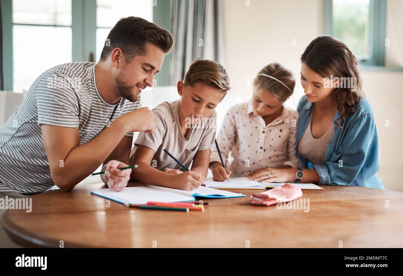Homework can be a fun way to connect with family. a happy young family ...