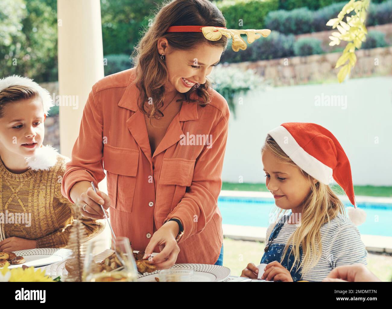 Everything just tastes better on Christmas. a beautiful young mother ...