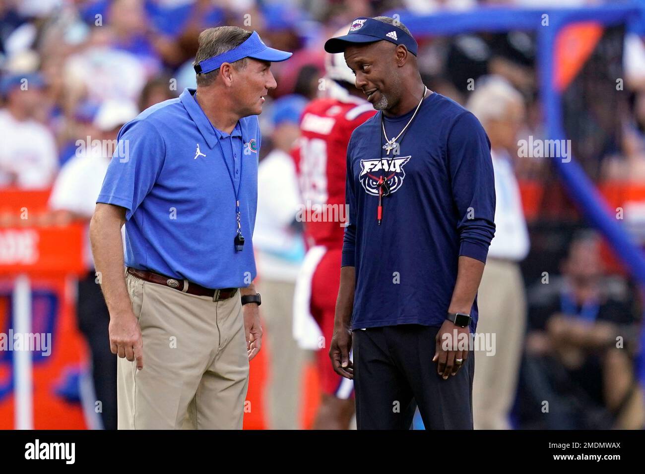 Florida head coach Dan Mullen, left, and Florida Atlantic head coach ...