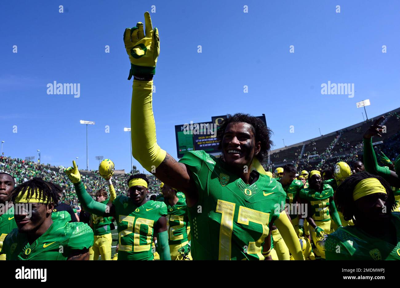 Oregon defensive back Bryan Addison (13) cheers after an NCAA college ...