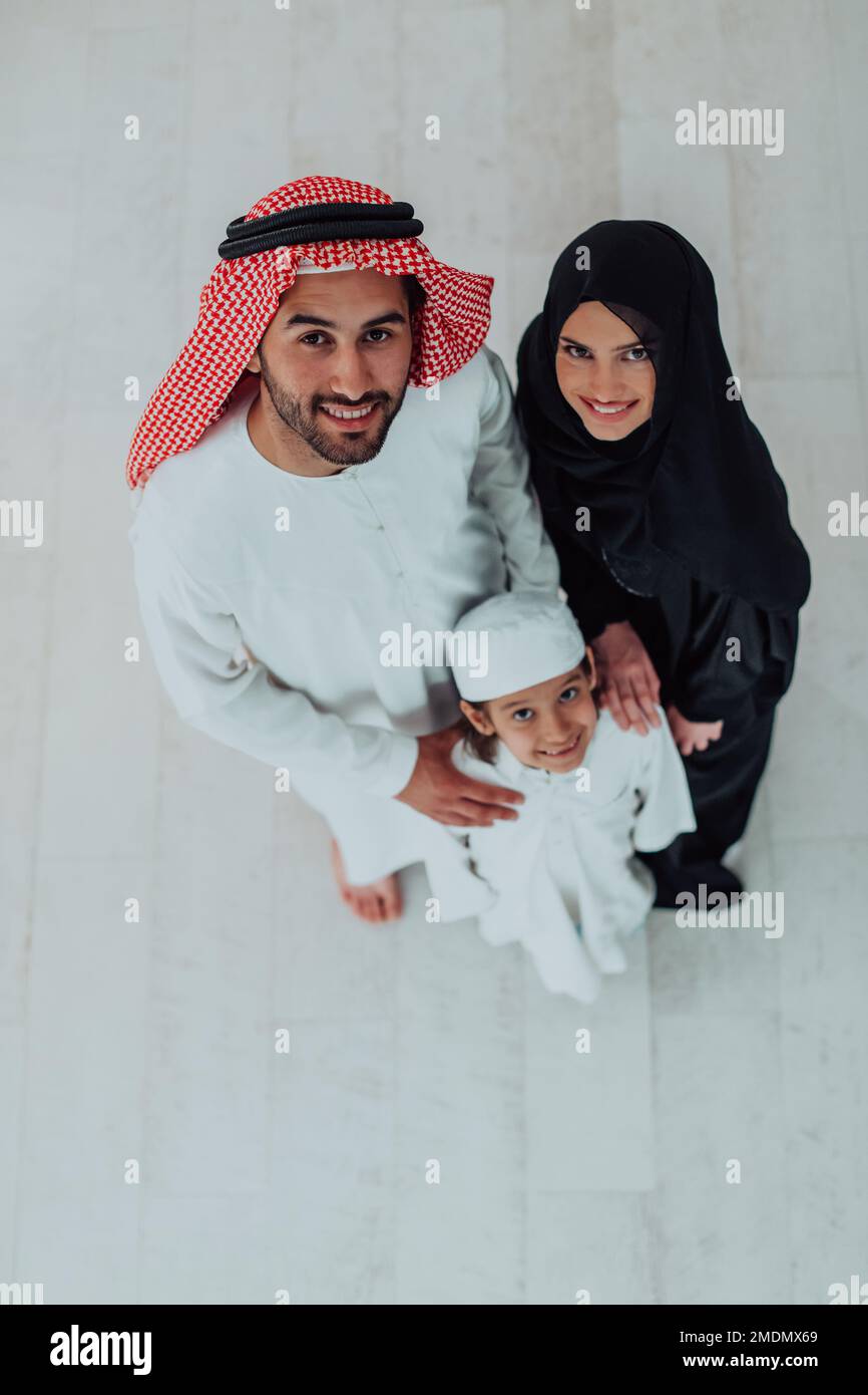Top view of young arabian muslim family wearing traditional clothes ...
