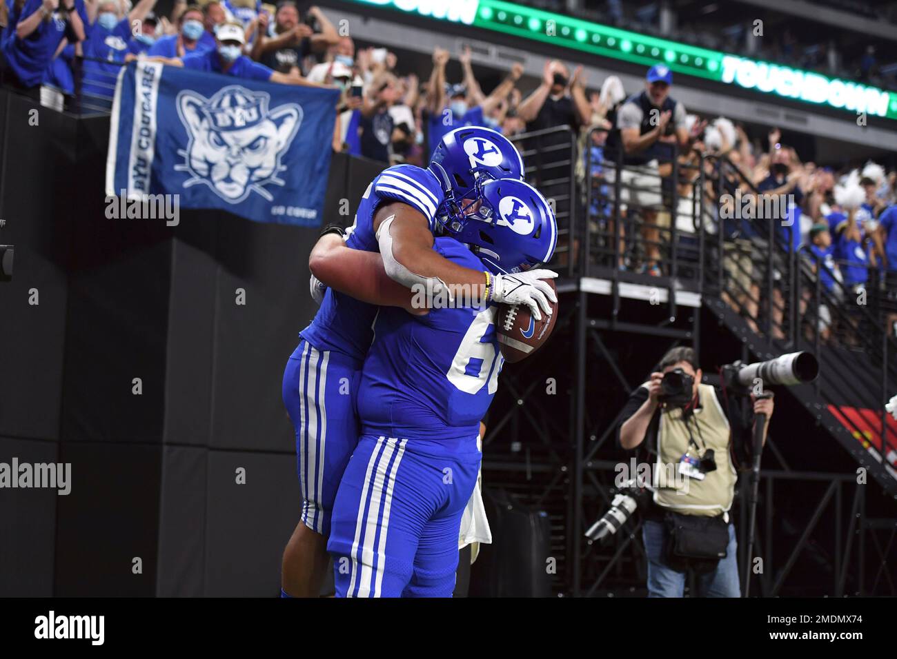 BYU running back Tyler Allgeier, left, celebrates with offensive ...
