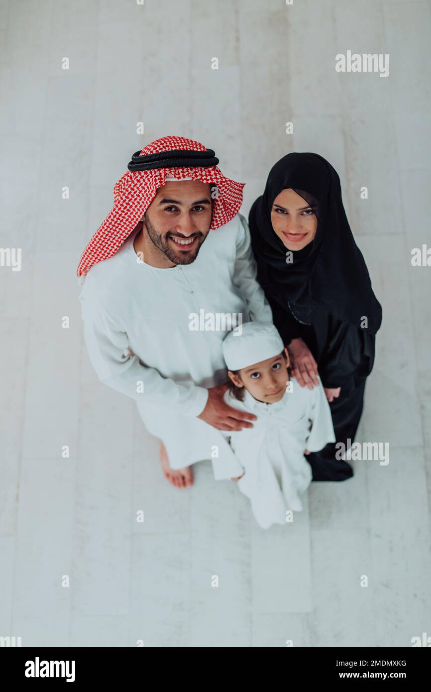 Top view of young arabian muslim family wearing traditional clothes ...