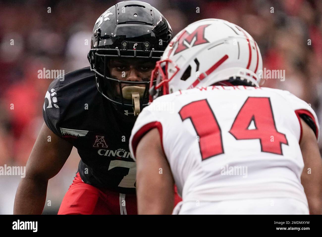 Cincinnati cornerback Coby Bryant, center left, lines up against Miami ...