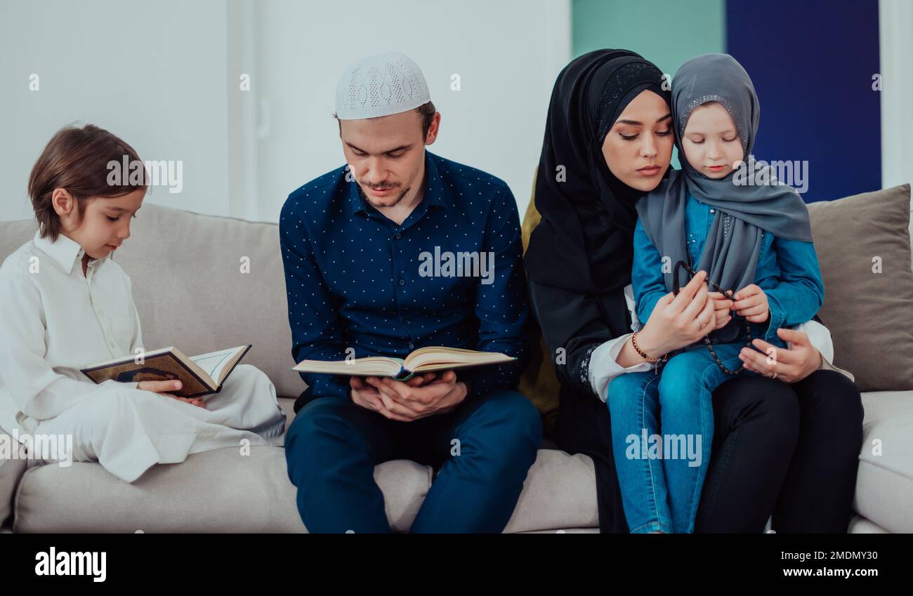 Happy Muslim family enjoying the holy month of Ramadan while praying ...