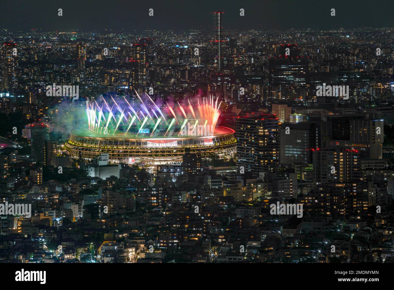 Fireworks illuminate over National Stadium viewed from Shibuya Sky ...