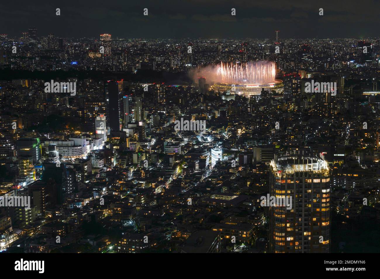 Fireworks illuminate over National Stadium viewed from Shibuya Sky ...