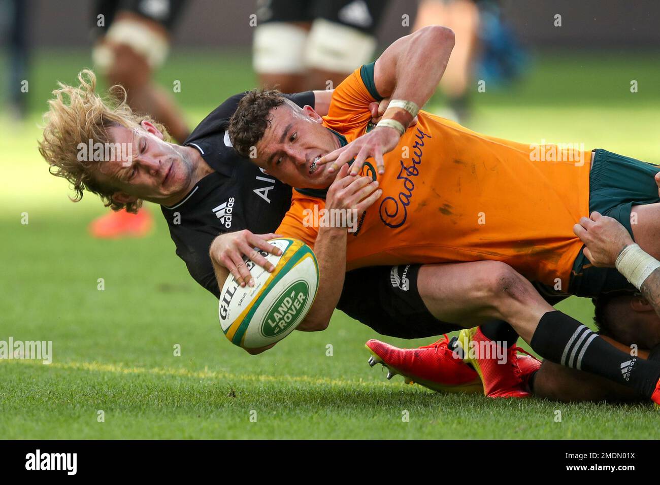 Australia's Tom Banks scores a try in the tackle of New Zealand's ...