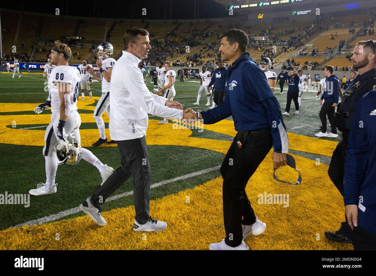 California head coach Justin Wilcox, left, greets Nevada head coach Jay ...