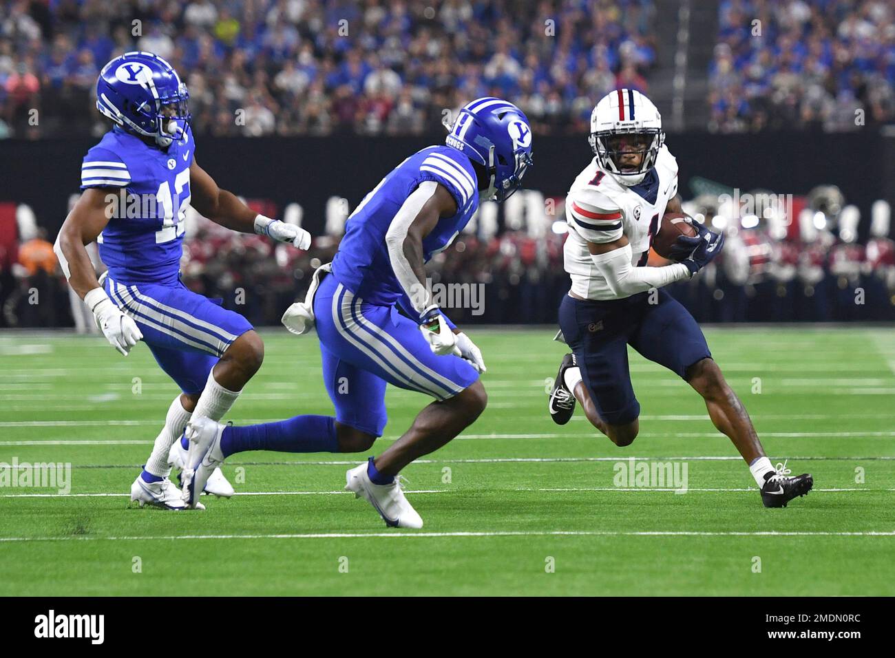Arizona wide receiver Stanley Berryhill III carries agains the defense ...