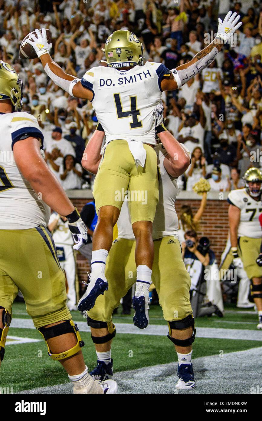 Georgia Tech running back Dontae Smith (4) is lifted by offensive ...