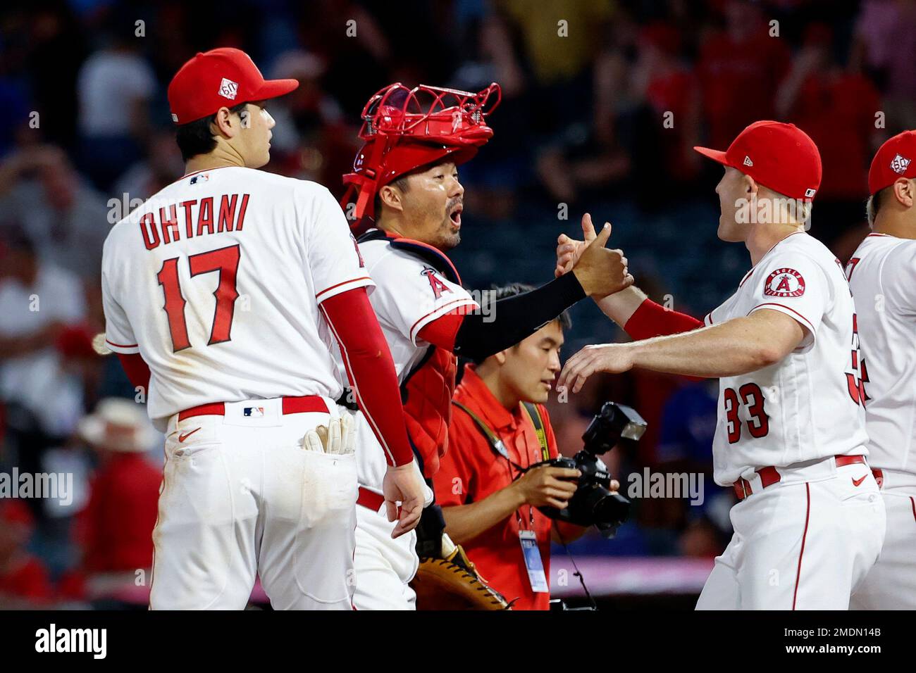 Los Angeles Angels catcher Kurt Suzuki , center, celebrates with Max ...