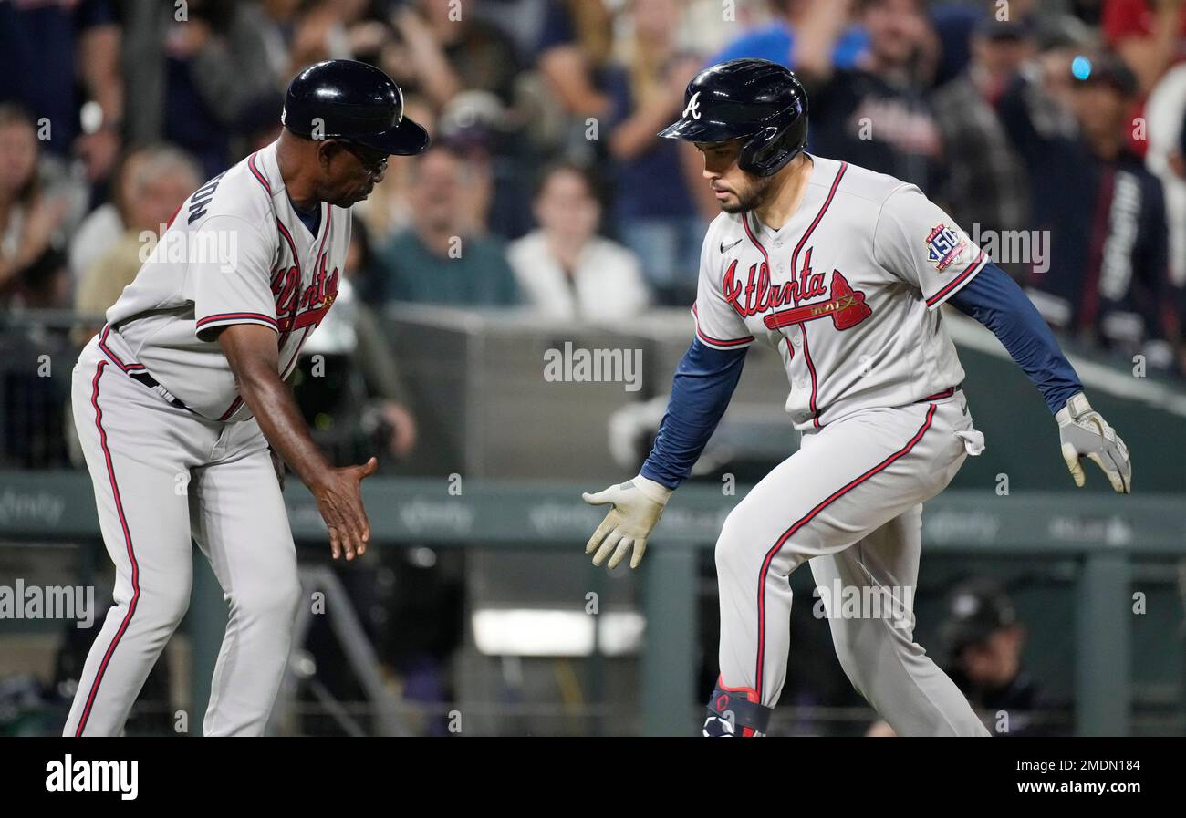 Atlanta Braves third base coach Ron Washington, left, congratulates ...