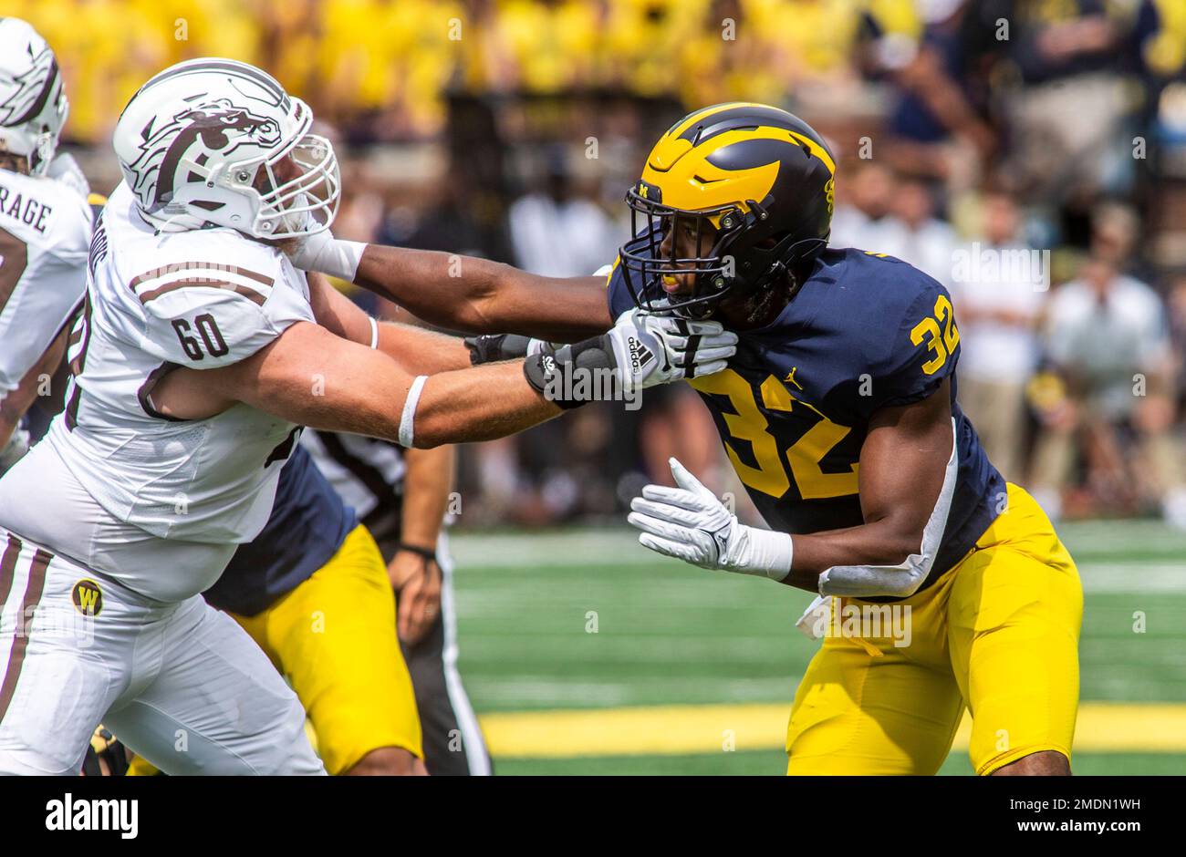 Western Michigan offensive lineman Mark Brooks (60) holds back Michigan ...