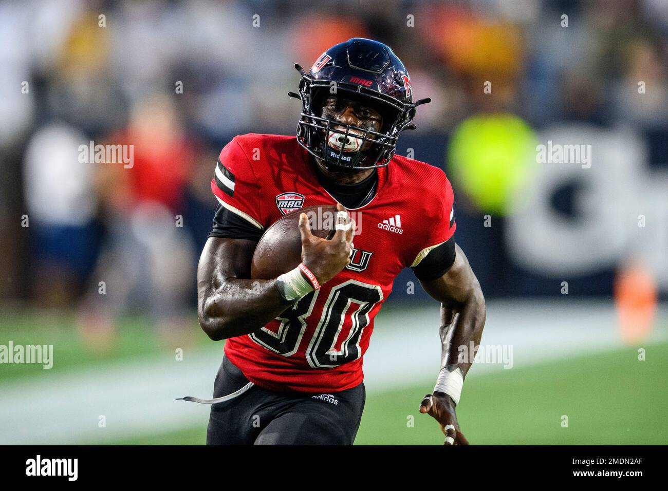 Northern Illinois running back Harrison Waylee (30) runs toward the end ... Northern Illinois running back Harrison Waylee (30) runs toward the end ...