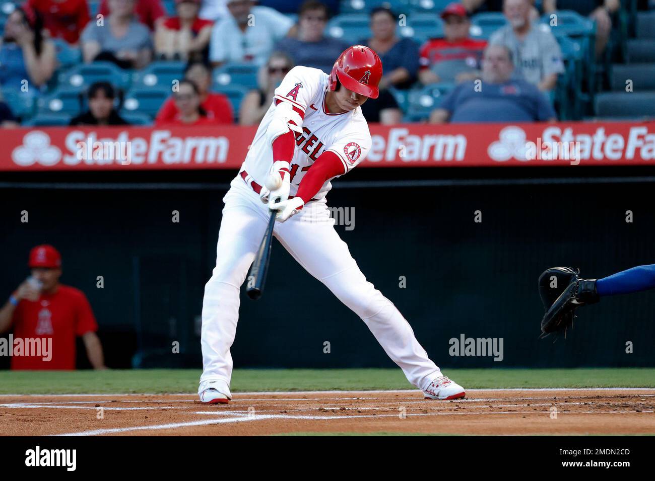 Los Angeles Angels' Shohei Ohtani swings at a Texas Rangers pitch ...
