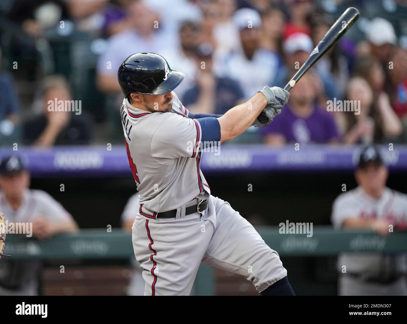 Atlanta Braves' Adam Duvall follows the flight of his RBI-double off ...