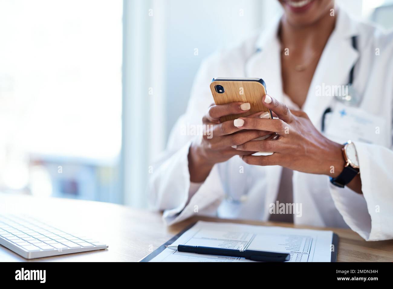 One of the smartest tools a doctor can use. a doctor using a smartphone ...