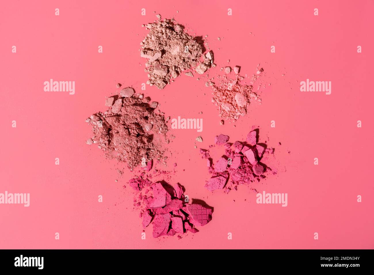 Abstract composition made from crushed face powder and blush on pink ...