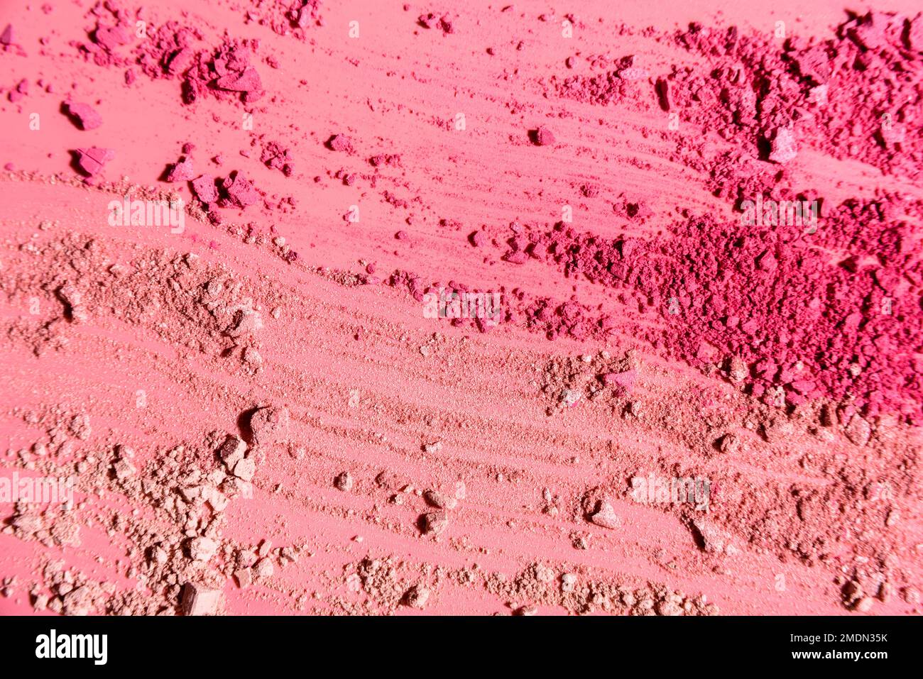 Abstract horizontal composition made from crushed face powder and blush ...