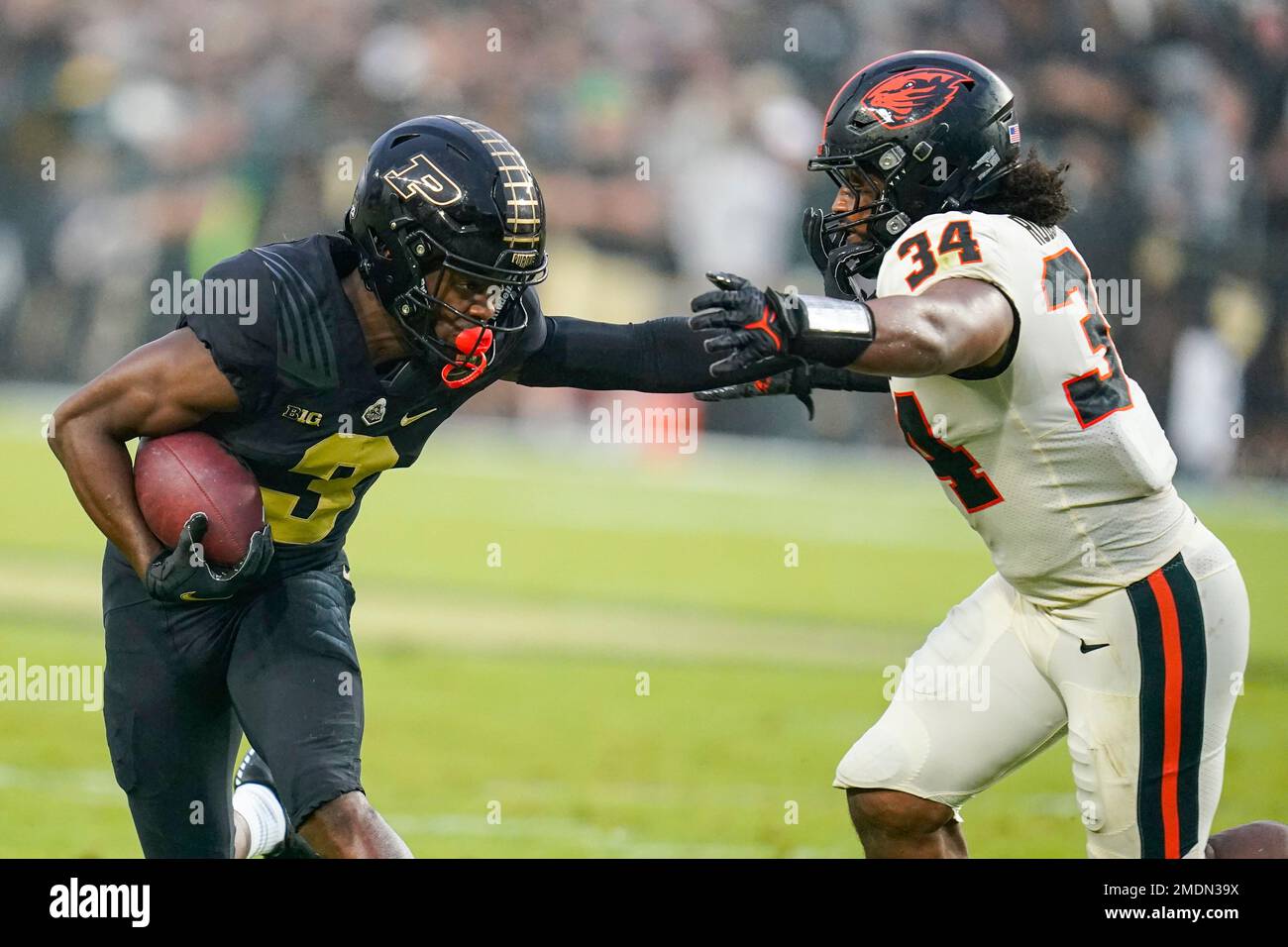 Purdue wide receiver David Bell (3) pushes off the tackle of Oregon ...