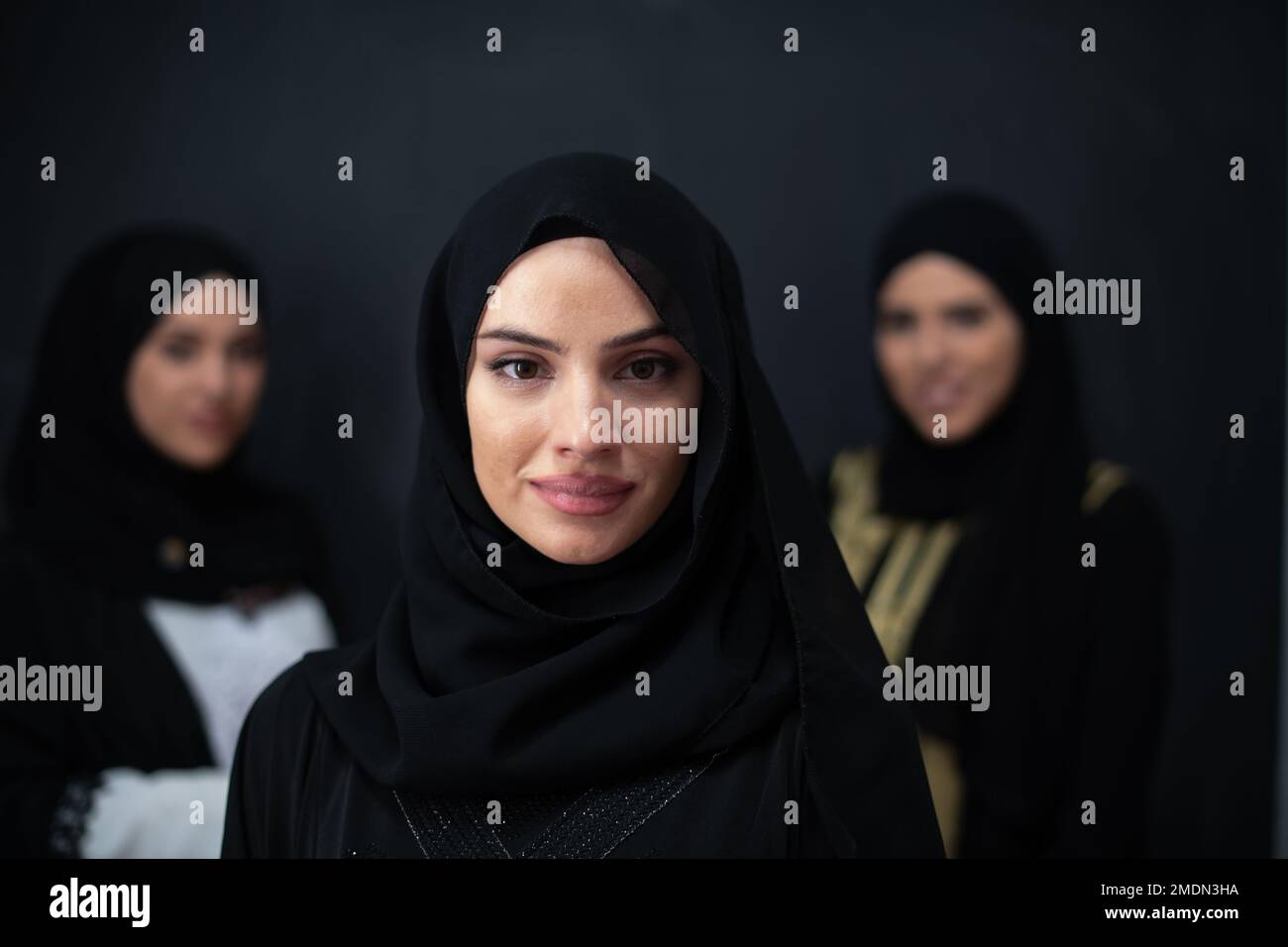 Group portrait of beautiful Muslim women in a fashionable dress with ...