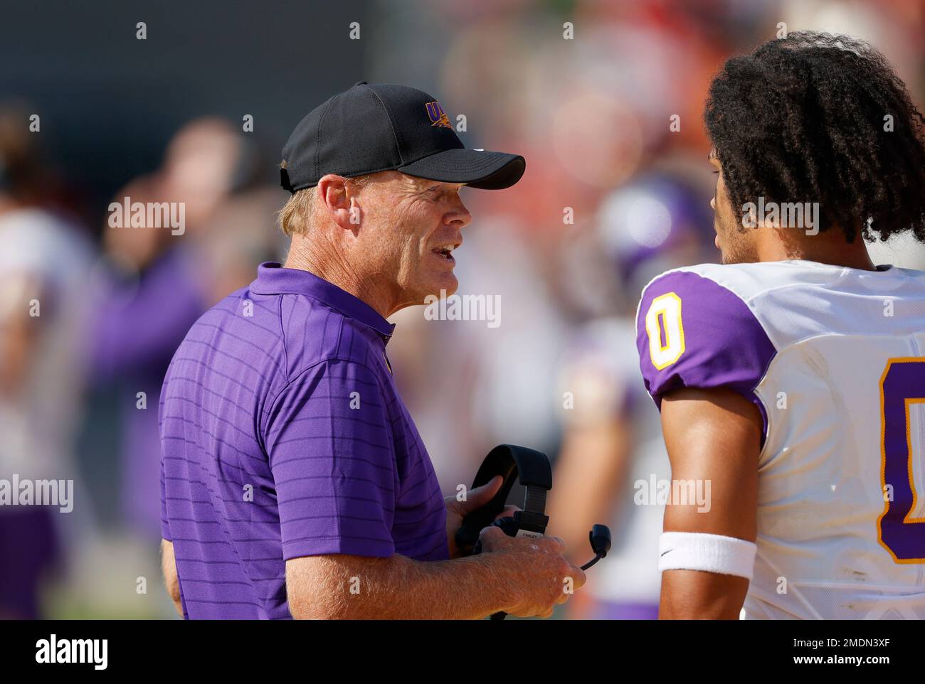 Northern Iowa head coach Mark Farley talks with Northern Iowa defensive ...