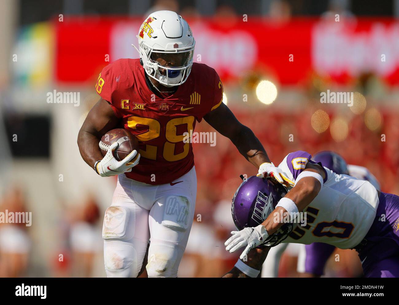 Iowa State running back Breece Hall (28) runs the ball as he eludes a ...
