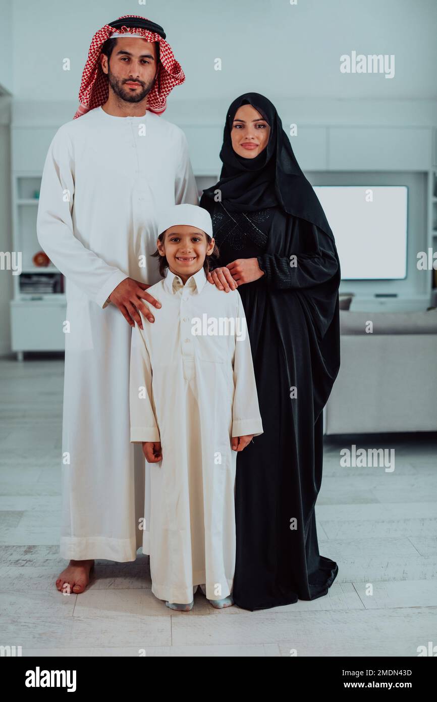 portrait of young happy arabian muslim family couple with son in ...