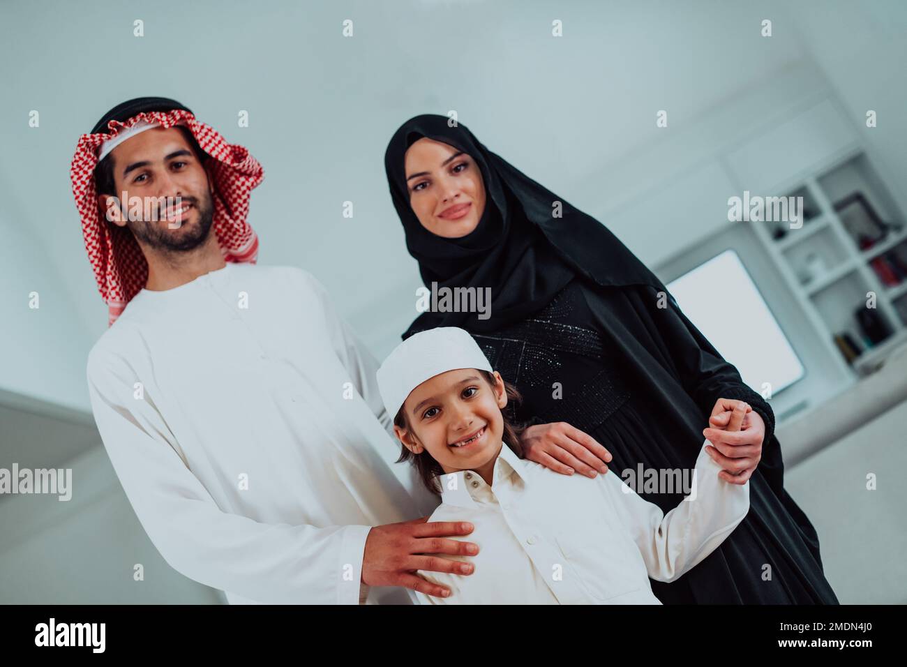 portrait of young happy arabian muslim family couple with son in ...