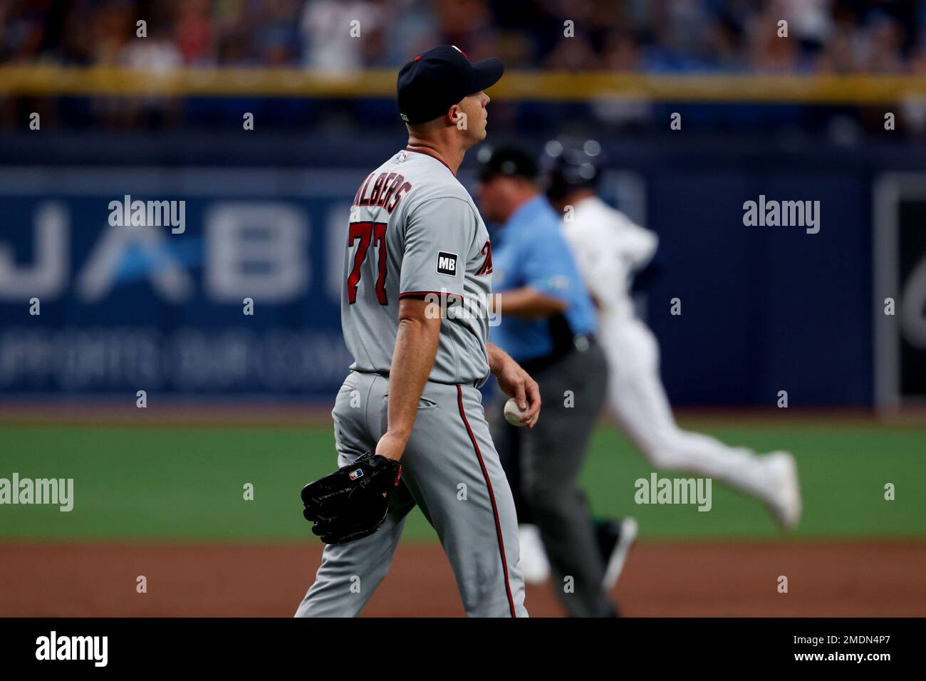 Minnesota Twins starting pitcher Andrew Albers (77) heads back to mound ...
