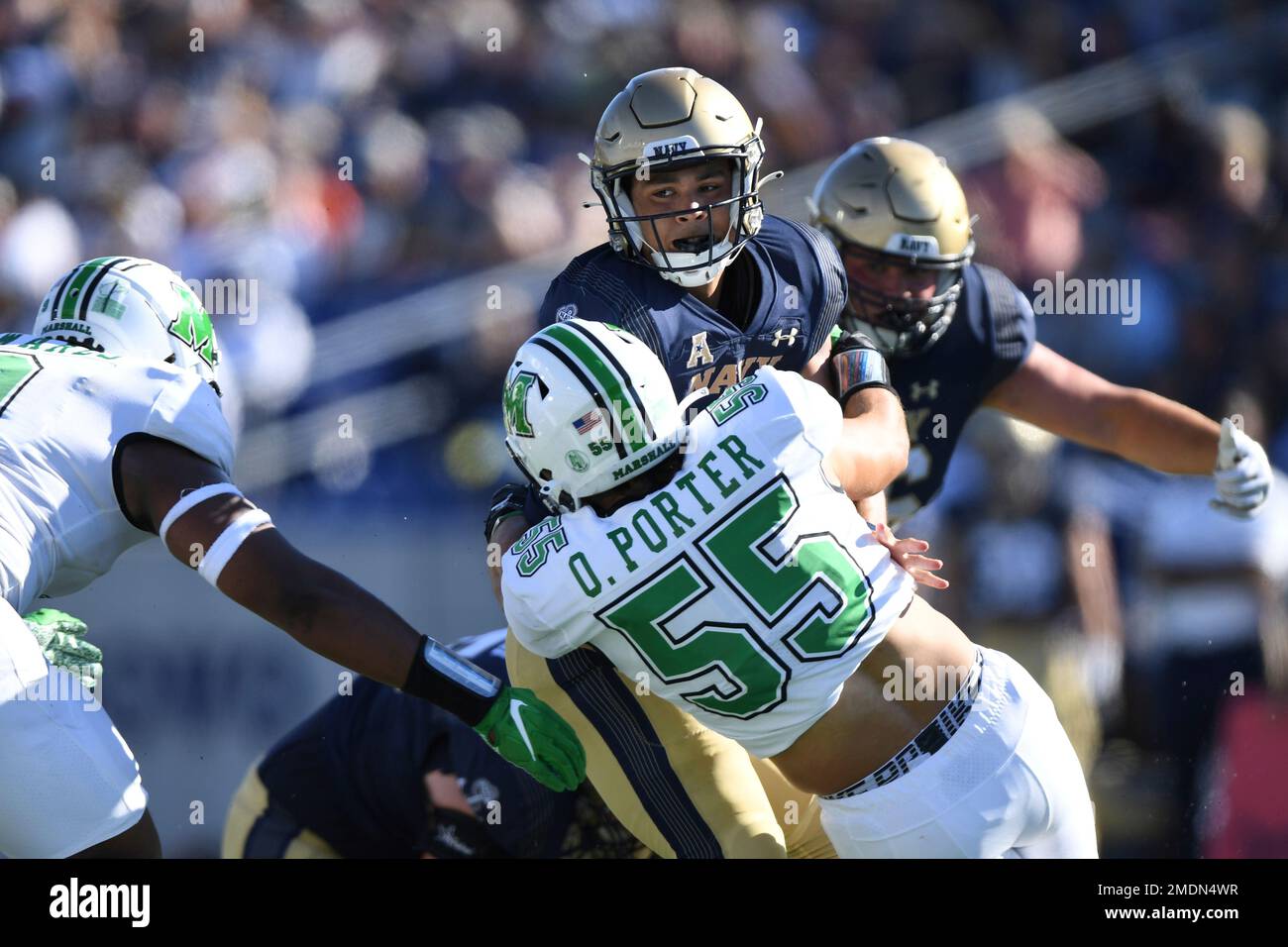 Navy quarterback Tai Lavatai (1) is sacked by Marshall defensive ...