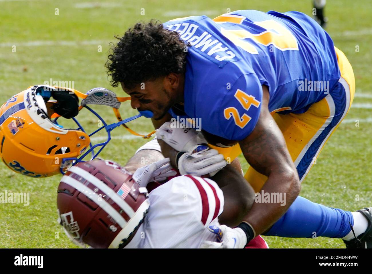 Pittsburgh linebacker Phil Campbell III (24) loses his helmet as he ...