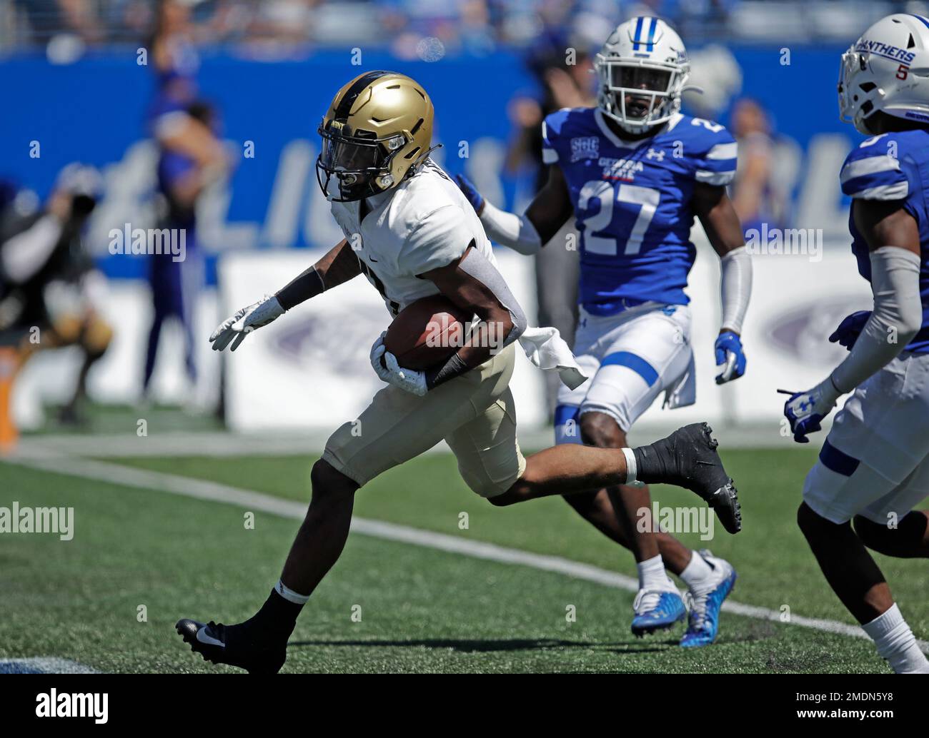 Army running back Braheam Murphy, left, runs past Georgia State's ...