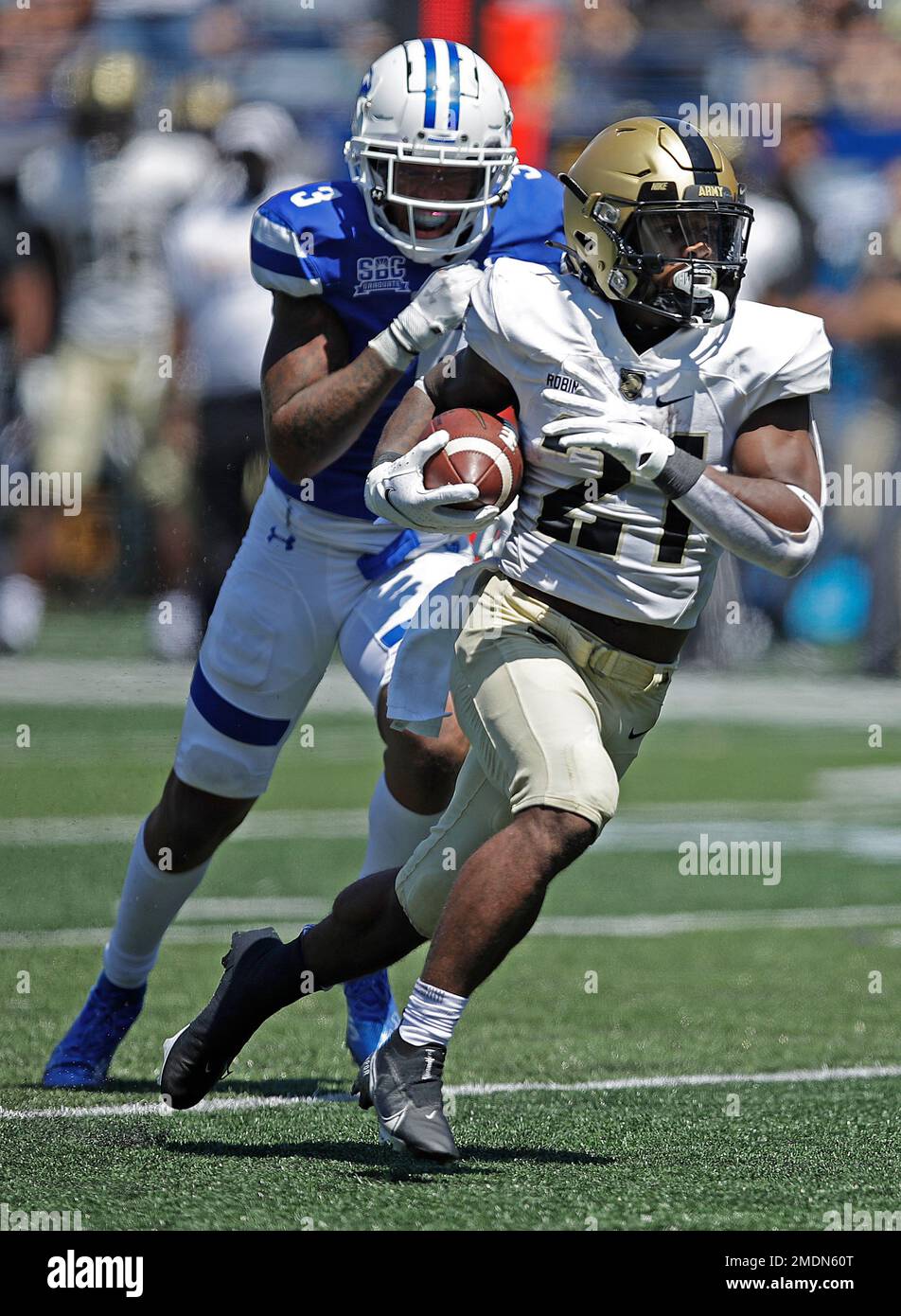 Army running back Tyrell Robinson, right, outruns Georgia State safety ...