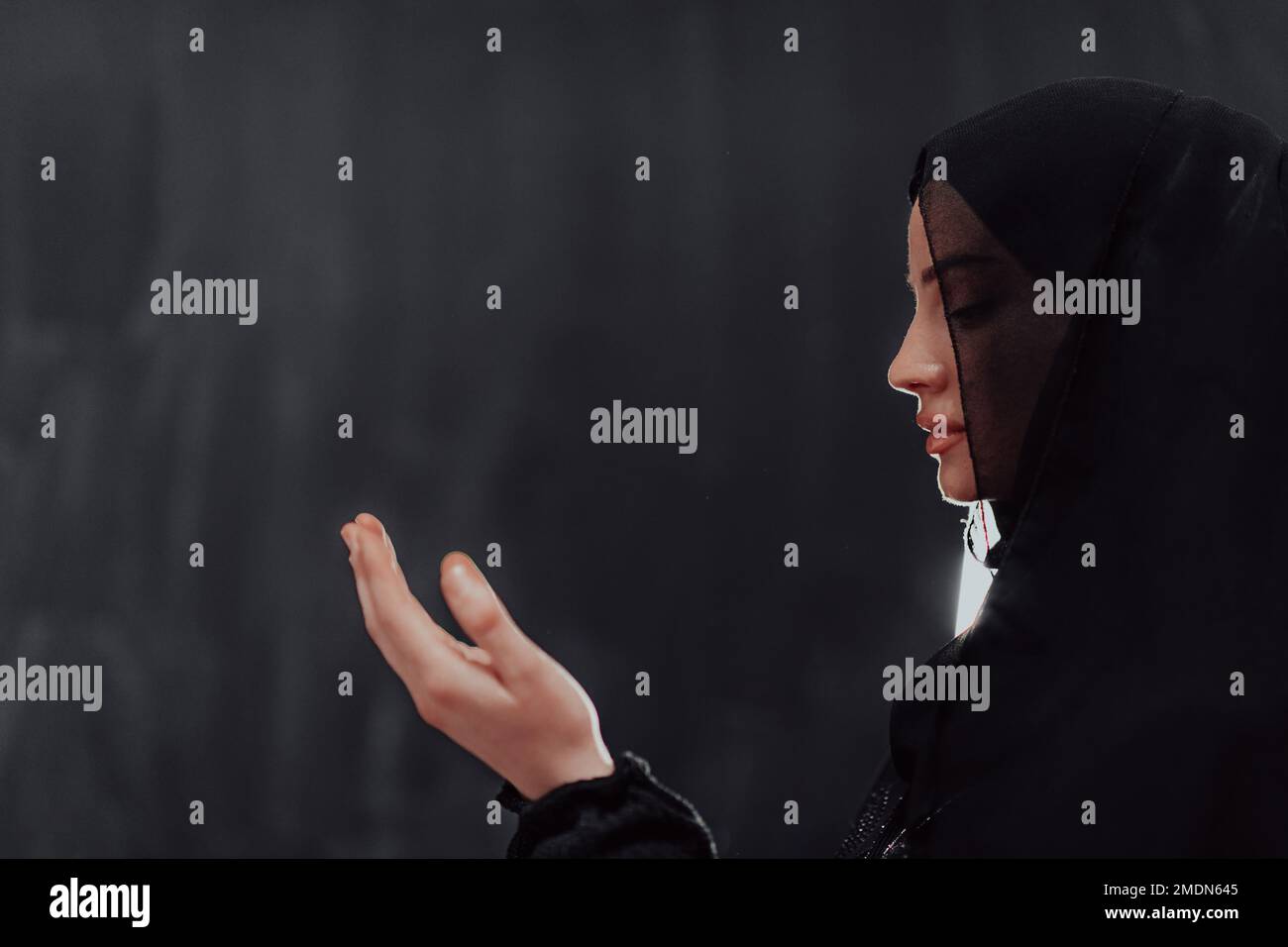 Portrait of young Muslim woman making dua Stock Photo - Alamy